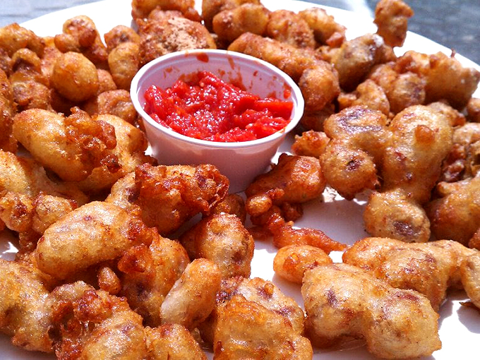 Gizzard City's crown jewels! These golden nuggets are the reason why chickens don't have six-packs. Dip and savor, my friends.