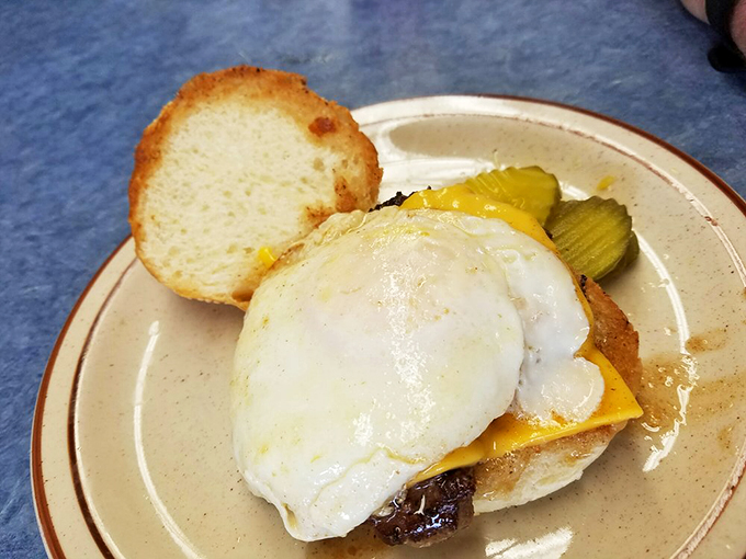 Egg-cellent engineering! Mickey's Special is a tower of taste, crowned with a perfectly fried egg. It's breakfast meets architecture.