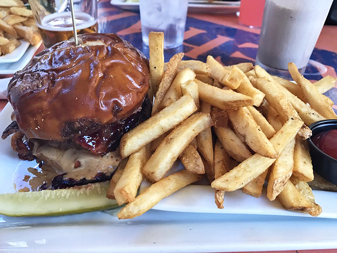 The PB&J burger brings its sidekick, crispy fries. It's the dynamic duo your taste buds never knew they needed.