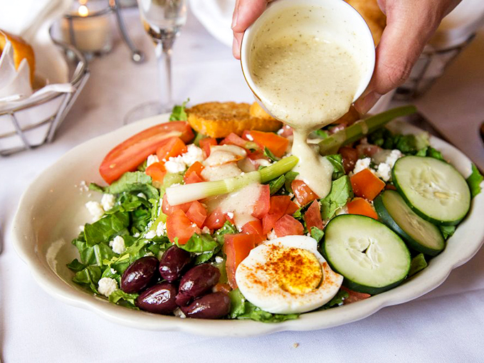 A salad that's not just rabbit food! This colorful creation is getting the VIP treatment with a creamy cascade of dressing.