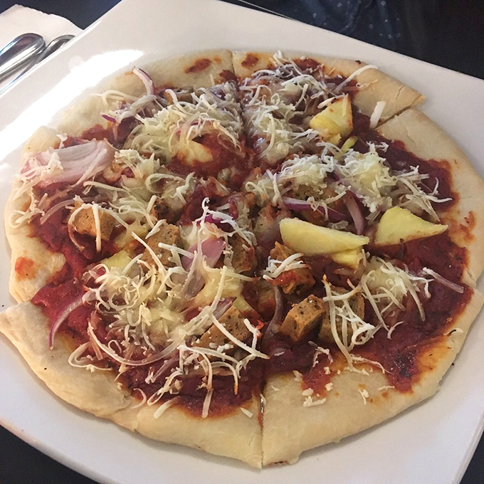 Aloha, deliciousness! This vegan pizza proves that pineapple on pizza isn't just acceptable, it's downright revolutionary.