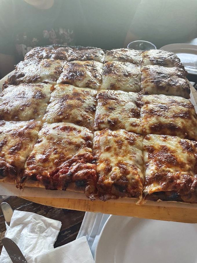 Cheese lovers, rejoice! This Sicilian square is like a warm, gooey blanket of happiness. It's not a pizza, it's a work of art.