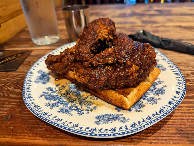 A match made in culinary heaven. Crispy chicken perched atop a golden waffle – it's like breakfast and dinner had a delicious baby.