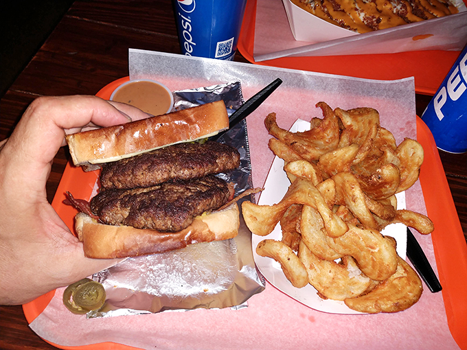 Double patty? More like double happiness! This burger's stacked higher than a Jenga tower, and twice as fun to demolish.