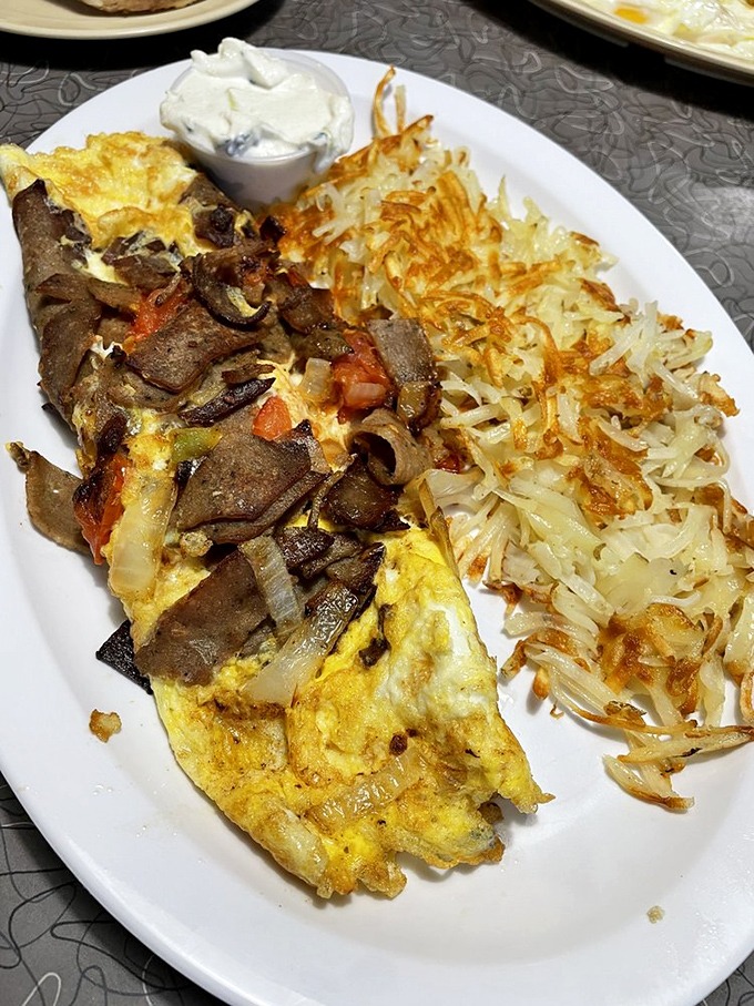 The gyro omelet: Where Mediterranean meets Midwest. It's a cultural exchange program on a plate, with a side of crispy potato diplomacy.