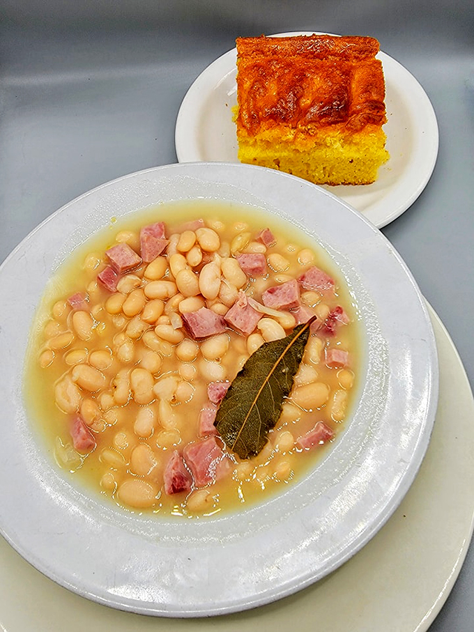 Comfort food alert! This ham and bean soup with cornbread is like a warm hug from your grandma, if your grandma was a culinary genius.