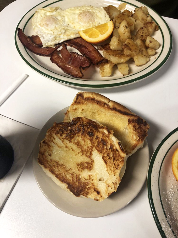 Breakfast of champions! With eggs sunny-side up and toast this good, you'll be ready to conquer the day... or maybe just take a delicious nap.