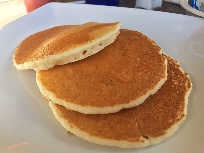 Stack 'em high and watch 'em fly! These fluffy pancakes are begging for a river of syrup and a pat of melting butter.