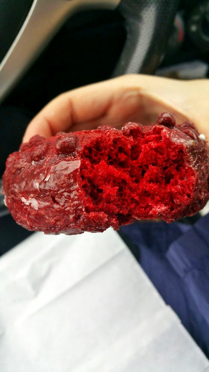 Behold, the heart of red velvet! This cross-section reveals a crumb so moist and tender, it could make a grown man weep tears of sugary joy.