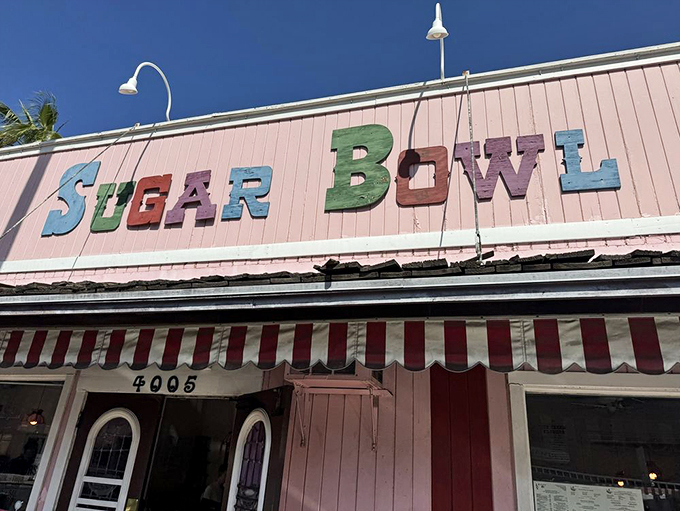 Neon dreams! The Sugar Bowl's sign is a beacon of sweetness, guiding dessert lovers like a sugary North Star.