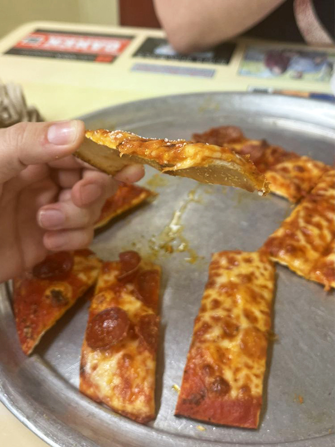 Cracker-thin and crispy as autumn leaves, this pizza crust is the unsung hero of the Rubino's experience.