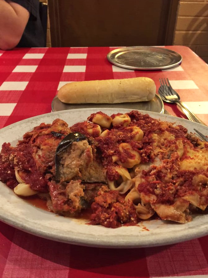 A plate that proves some family recipes are worth keeping secret - layers of pasta, sauce, and tradition served with a side of nostalgia.
