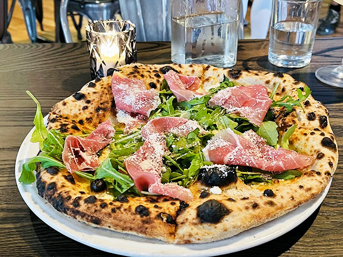Who needs tomato sauce when you've got this stunner? This white pizza, adorned with prosciutto and arugula, is like a fancy Italian picnic on a perfectly charred crust.