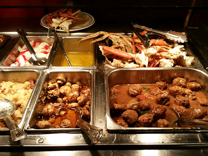 Behold, the United Nations of comfort food! From meatballs to crab legs, this buffet's got more options than a TV remote.