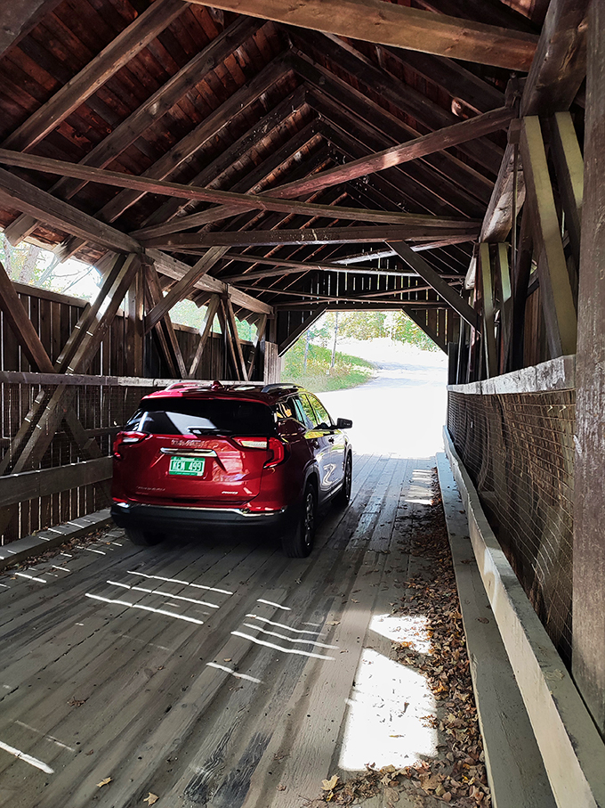 Car meets covered bridge: A modern-day knight in shining armor braves the wooden dragon's lair. Spoiler alert: They both win!