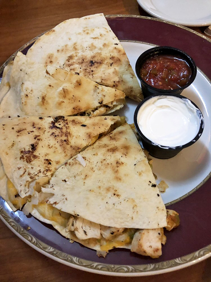 Cheese, please! This quesadilla is stretching the limits of deliciousness. It's like a warm, gooey hug for your taste buds.