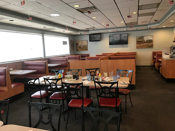 Retro charm meets modern comfort in this inviting dining space. It's where memories are made, one bite at a time.