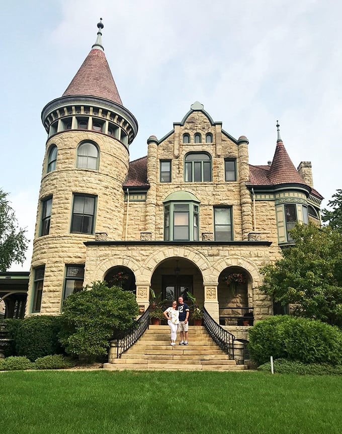 "Honey, I think we took a wrong turn at Albuquerque and ended up in a castle!" These guests look right at home on the grand entrance steps.