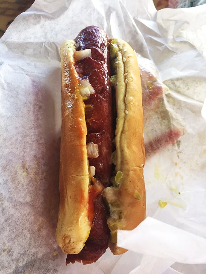 Hot diggity dog! This isn't just any wiener, it's a flavor torpedo ready to launch. Topped with enough fixings to make a salad bar jealous.