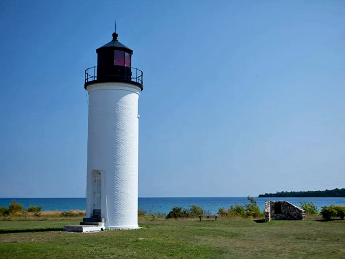 This lighthouse is so picturesque, it's like Mother Nature's own selfie stick for Lake Michigan.