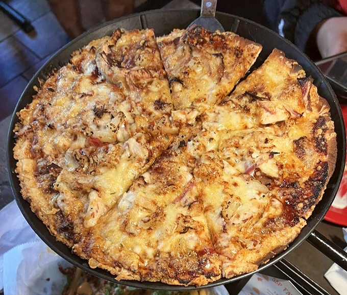 Cheese, please! This pizza's so perfectly golden, it could win an Olympic medal in deliciousness.