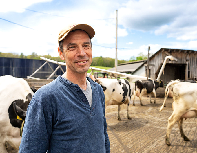 Meet the man behind the moo-vement! This farmer's smile is as genuine as the Vermont cheddar &ndash; and twice as sharp.