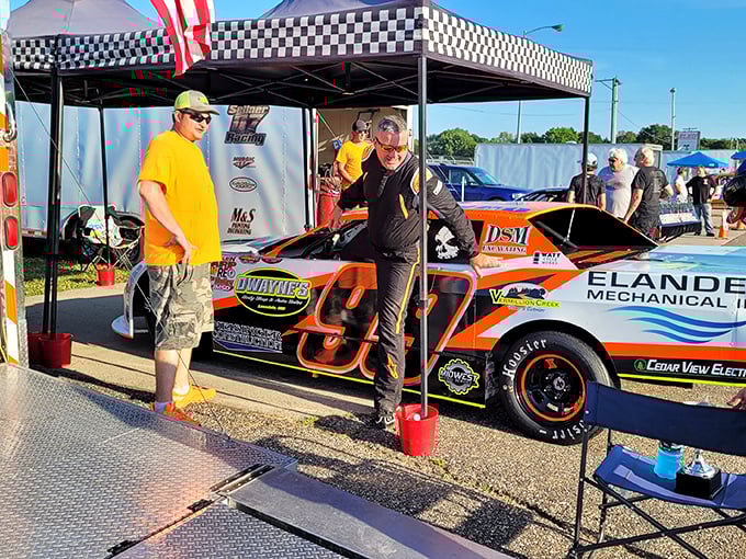 Pit stop or pep talk? These colorful cars and their dedicated crews are the unsung heroes of race day.