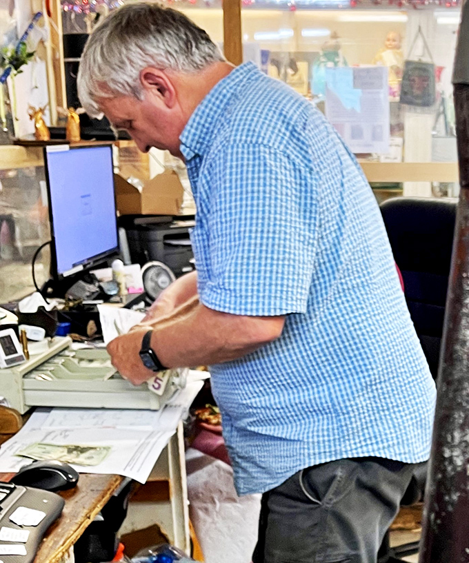 Meet the wizard behind the curtain! This dedicated staffer is probably typing "time machine" into that computer, searching for the next great find.