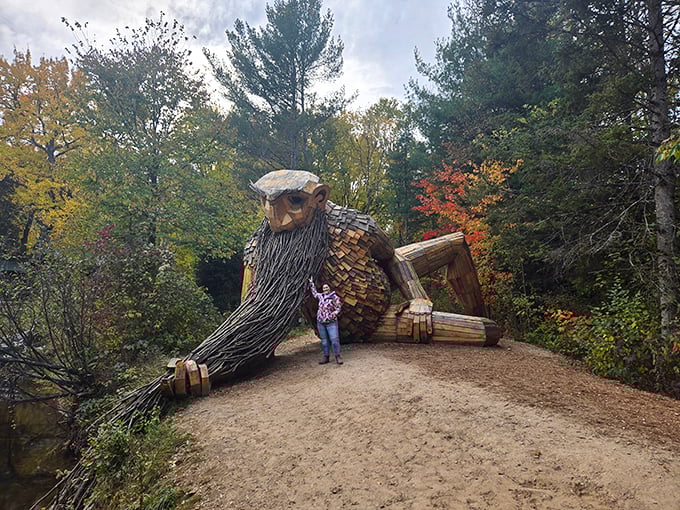 Honey, I shrunk the humans! A visitor demonstrates the true scale of Benny's larger-than-life presence in the forest.