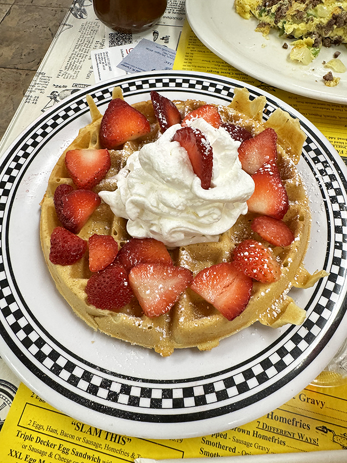 Waffle lovers, rejoice! This golden disc topped with berries and cream is what breakfast dreams are made of. It's the superhero of morning meals!