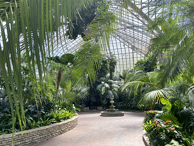 Glass, sass, and botanical class! This conservatory is like a greenhouse on steroids, with a side of Chihuly for good measure.