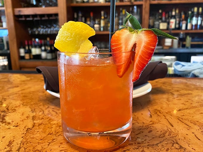 Cocktail o'clock at The Odd Duck! This vibrant concoction is like a liquid sunset, garnished with a slice of summer.