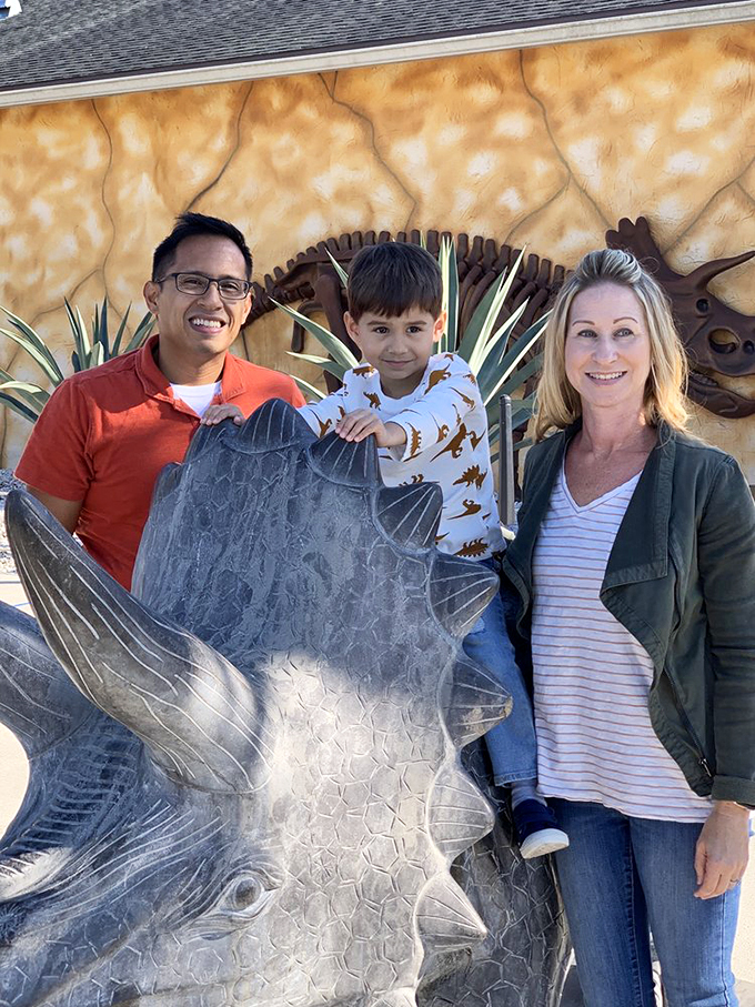 Family fun or Jurassic-sized photo op? Either way, this Stegosaurus makes for one unforgettable family portrait. No "cheese," just scales!