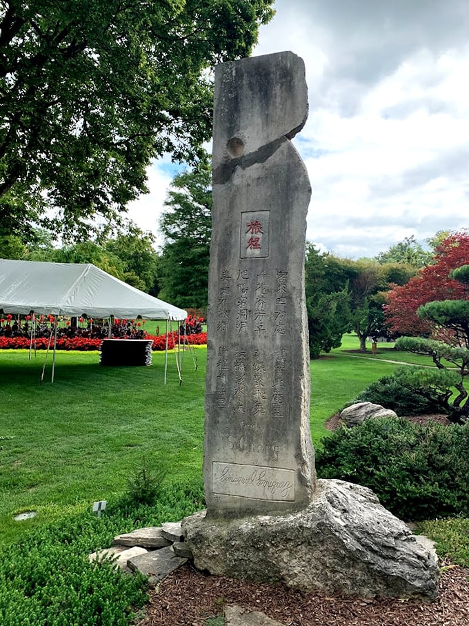 Ancient wisdom meets Midwest charm. This stone monolith adds a touch of mystery to the garden's serene atmosphere.