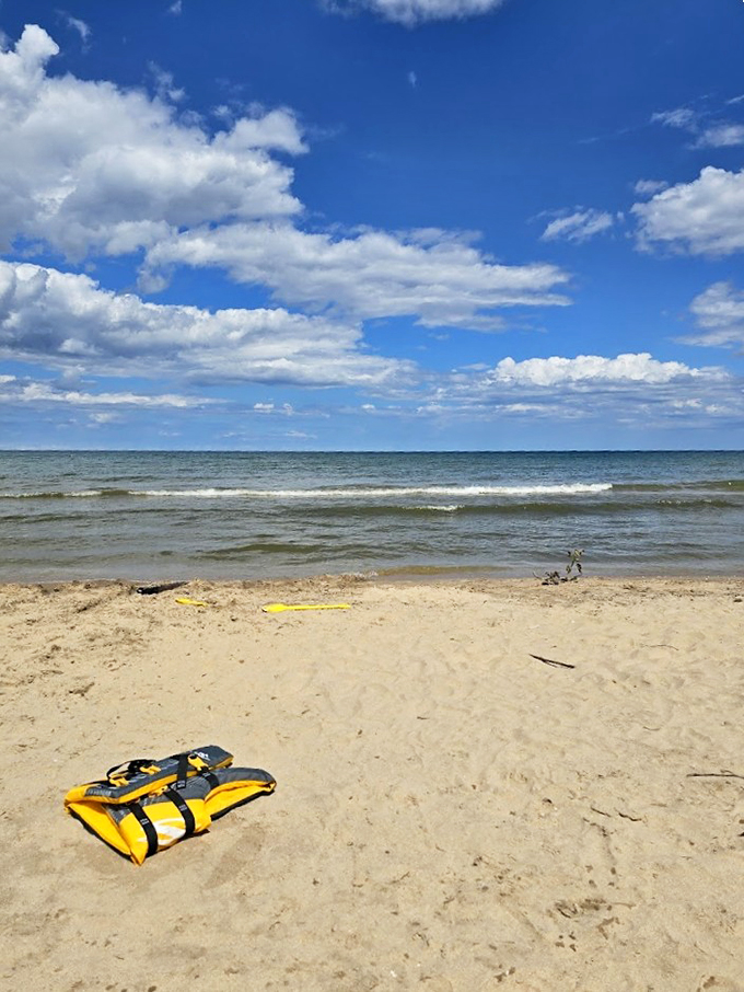 Lake Michigan or the Mediterranean? Gentle waves lap at a sandy shore, creating a beachfront paradise that rivals any coastal getaway.