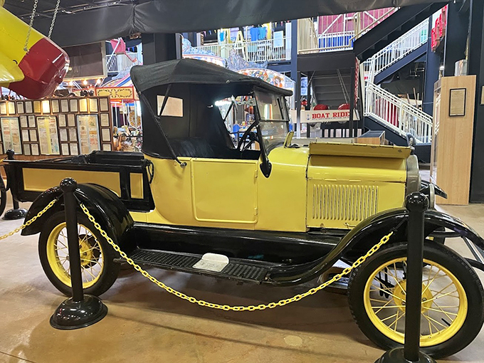 Lemon-yellow and built for fun, this vintage car looks ready to lead a parade of childhood memories.