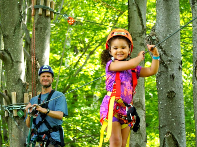 Family bonding reaches new heights! This dynamic duo proves that the family that zip-lines together, smiles together.