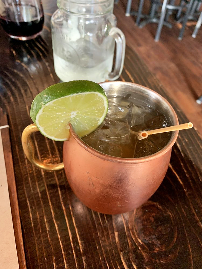 The Apple Jam Mule: Where cocktail meets comfort food. This copper mug holds the liquid equivalent of a warm apple pie hug.