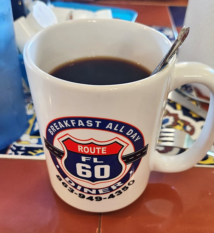 The elixir of life, served in a mug that's seen more stories than a library. This coffee could wake the dead (or at least the severely jet-lagged).