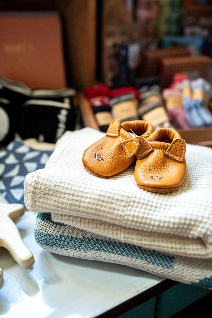 Aww-inducing baby moccasins and the coziest blankets &ndash; because even the tiniest Vermonters deserve to be stylish and snug.
