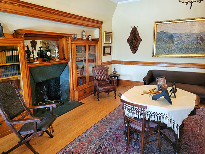 Curl up with a good book and a cold one in this cozy nook. It's like your local library and favorite pub had a very posh baby.