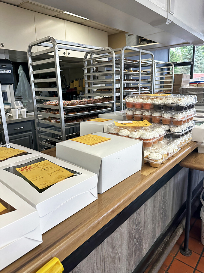 Behind the scenes of donut magic. These racks are the backstage pass to a sold-out show of flavor.