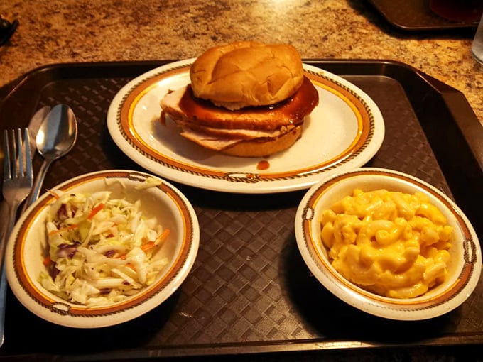 The holy trinity of BBQ perfection: A juicy turkey sandwich flanked by creamy coleslaw and mac 'n' cheese. It's comfort food that gives you a hug from the inside out.