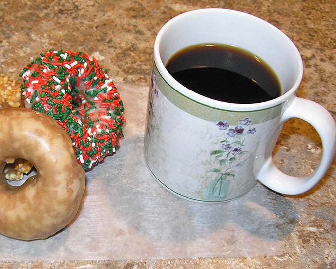 The dynamic duo of morning motivation: a steaming cup of joe and a festive donut. Breakfast of champions, indeed!
