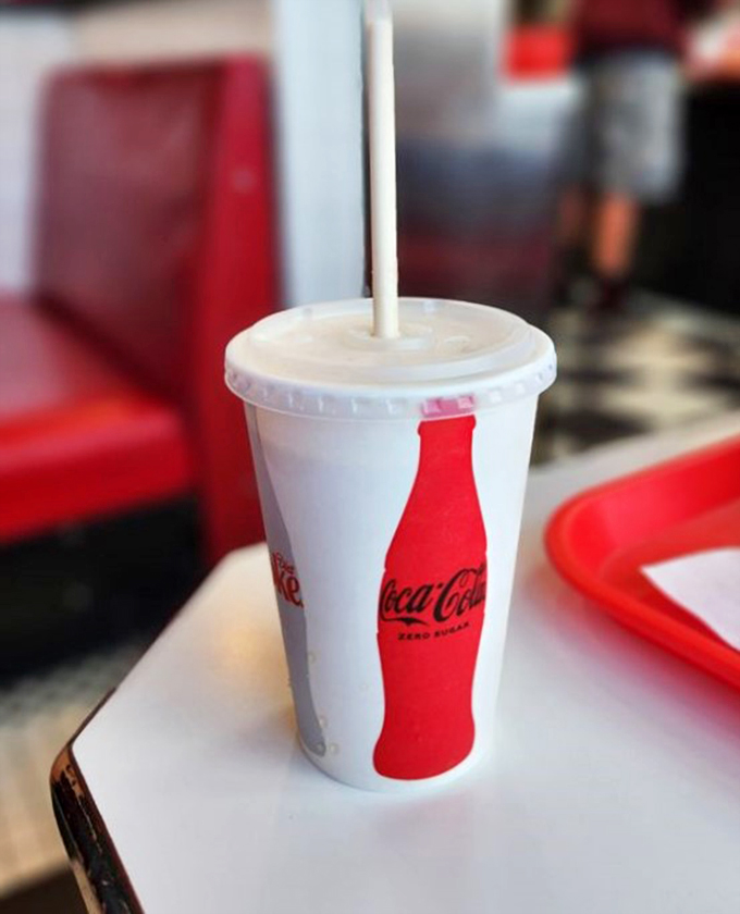 The classic Coke pause. Because sometimes you need a moment to contemplate life… and your next bite.