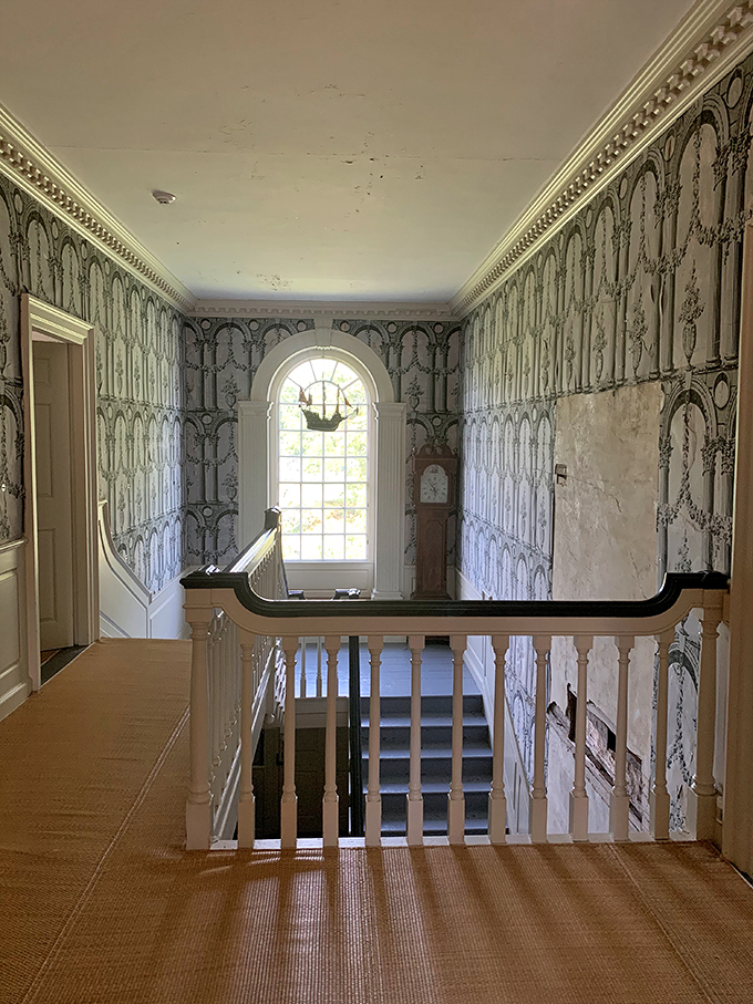 Up, up, and away into a world of Georgian splendor. This second-floor landing is giving serious "Downton Abbey meets New England" vibes.