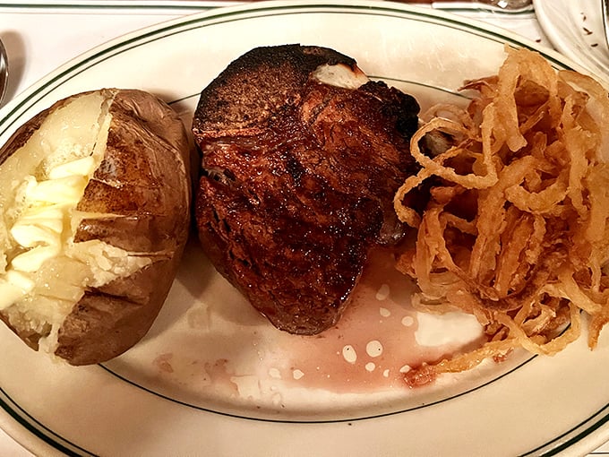 A plate that screams "Midwest comfort"! Juicy steak, crispy onion strings, and a baked potato so fluffy it might float away. Comfort food elevated to an art form.