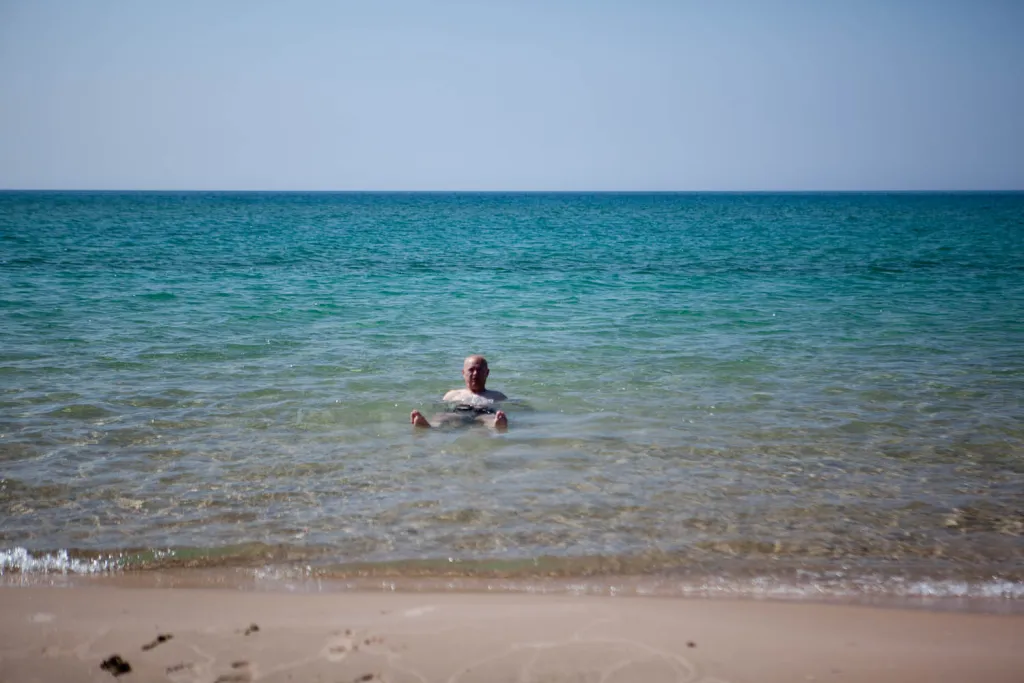 Who needs a heated pool when you've got crystal-clear waters and a smile that wide?