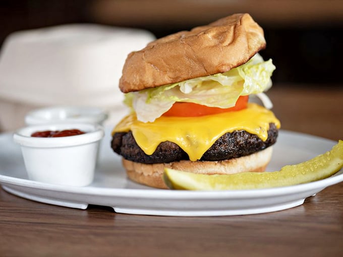 Burger bliss! This cheese-draped beauty is so photogenic, it could break Instagram faster than a cat video.