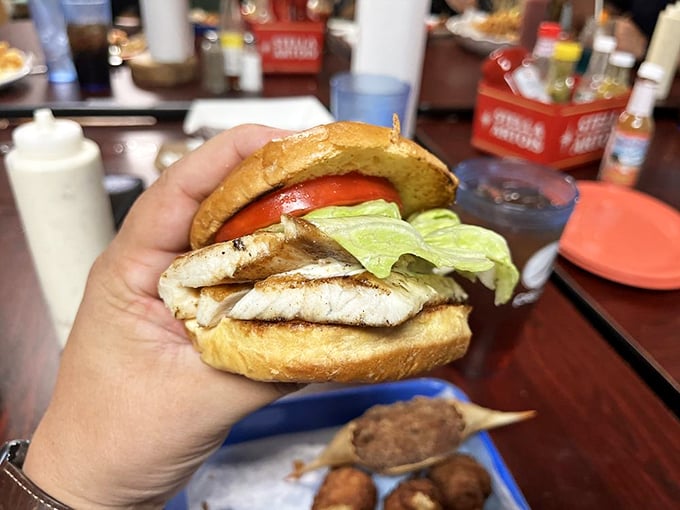 This isn't just a sandwich, it's a tower of aquatic awesomeness! Poseidon himself would approve of this catch.